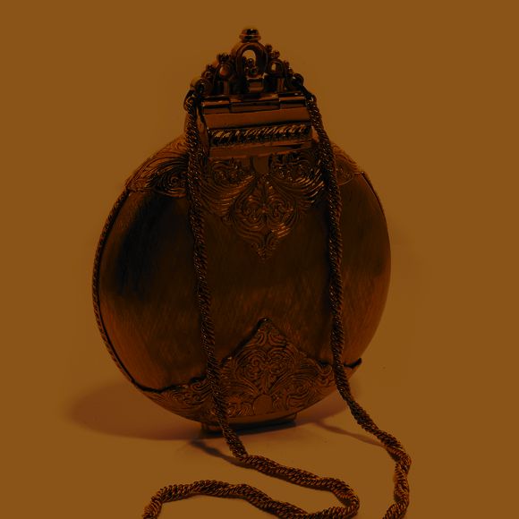 Bonhams : A gold colored metal embossed "disc" purse,