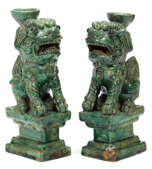 Bonhams : A pair Chinese green glazed ceramic fu lion form pricket ...