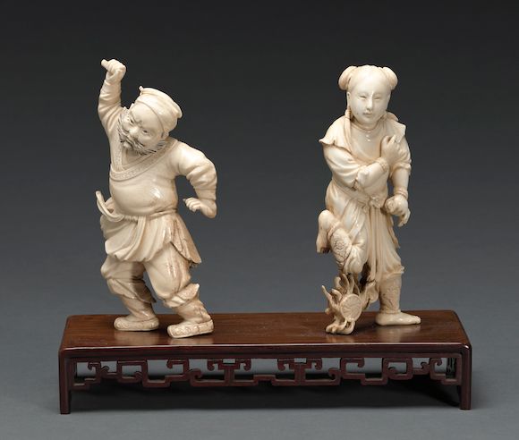 Bonhams : A pair of carved ivory figures 20th century