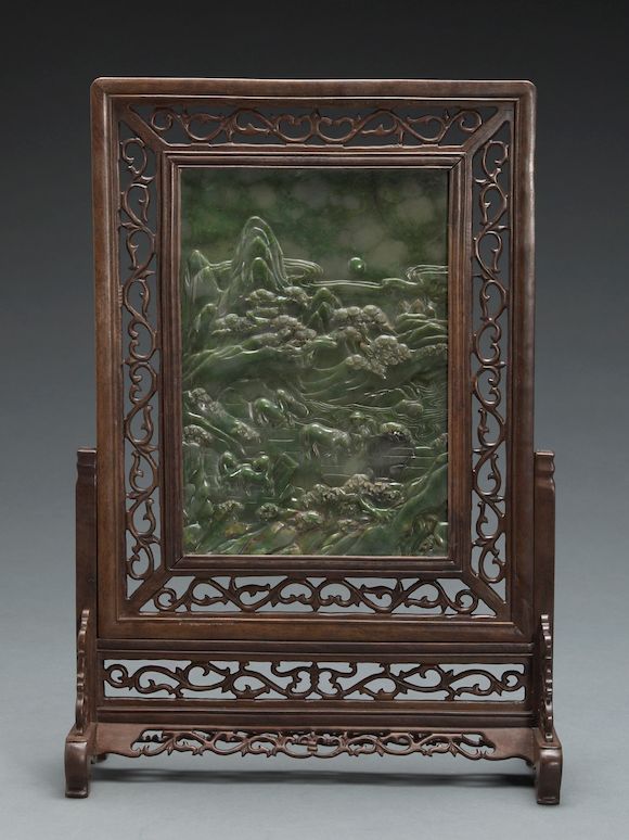 Bonhams : A spinach jade and reticulated wood table screen
