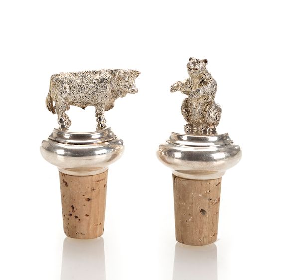 Bonhams : A pair of silver bull and bear bottle stoppers