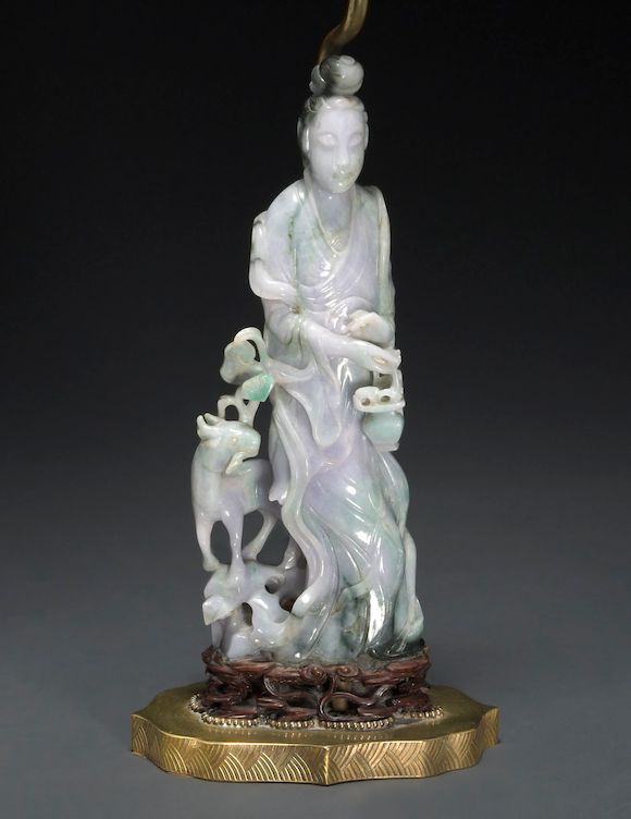 Bonhams : A mottled lavender and green jadeite figure of a female ...