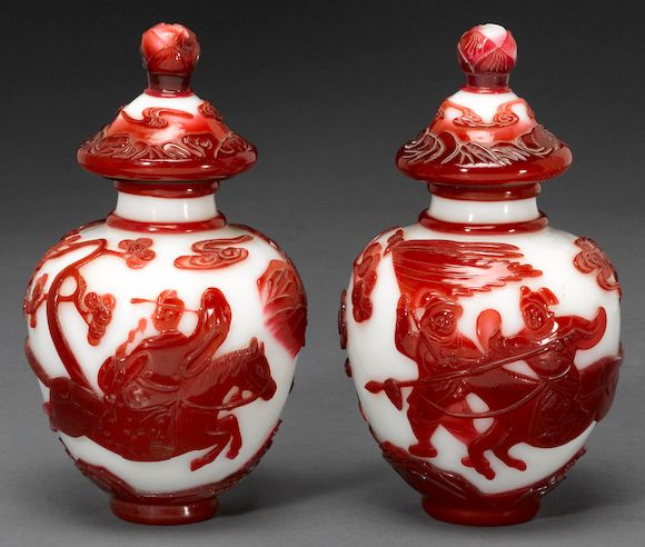 Bonhams : A pair of cranberry overlay white Peking glass covered jars