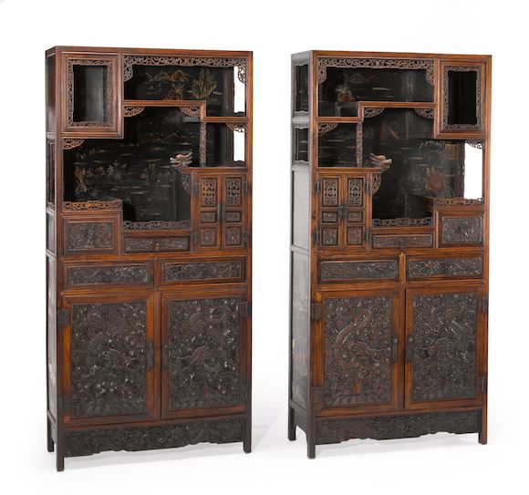 Bonhams : A pair mixed wood open shelf display cabinets