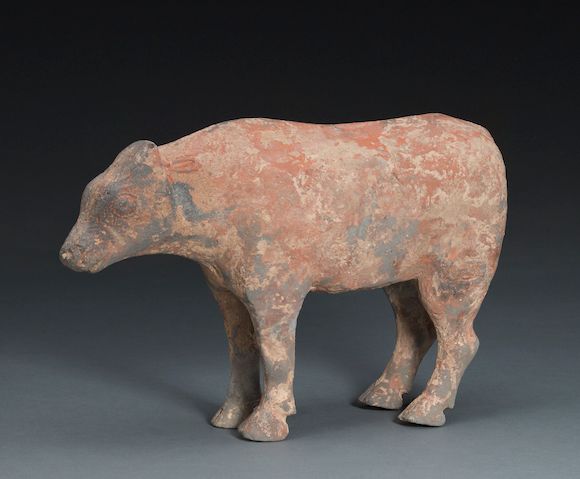 Bonhams : A red painted pottery figure of a bull Six Dynasties period