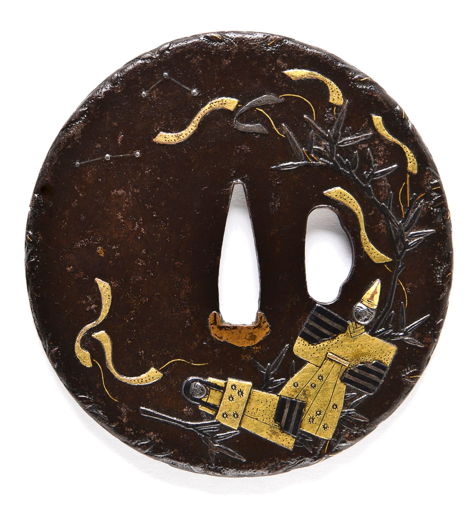 A HEAVY CIRCULAR IRON TSUBA decorated in brass inlay with flowering ...