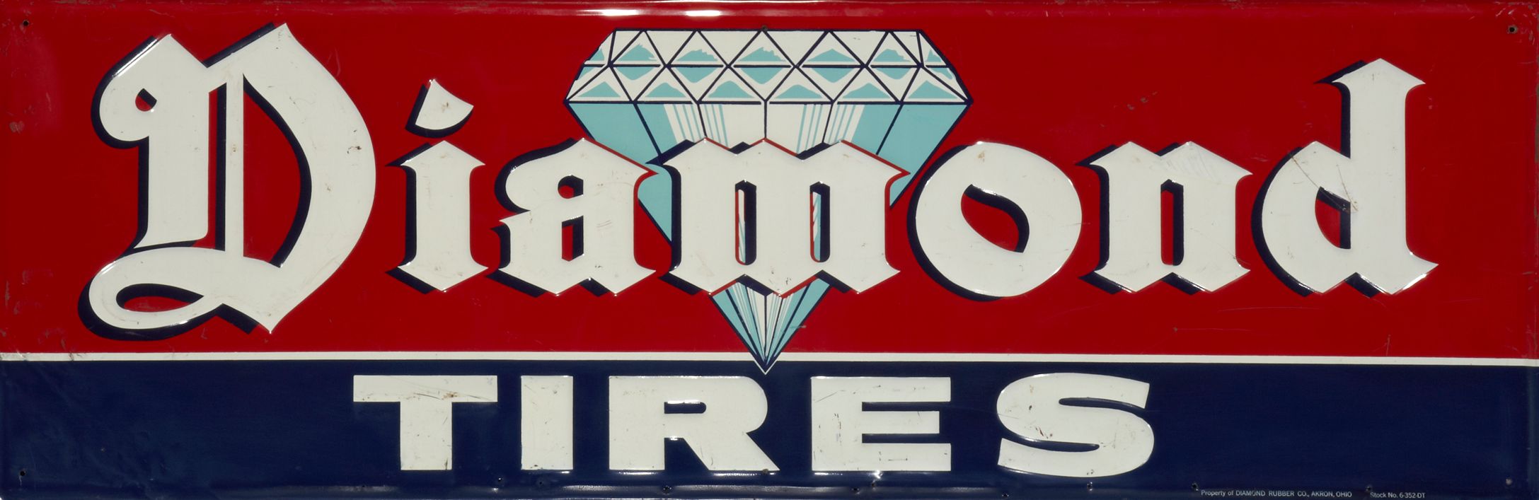 Bonhams Cars : A Diamond tires sign,