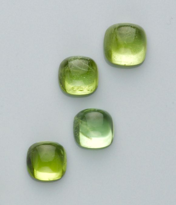 Bonhams : Group of Four Peridot Cabochons