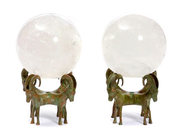 Bonhams : A pair of rock crystal orbs on bronze bases