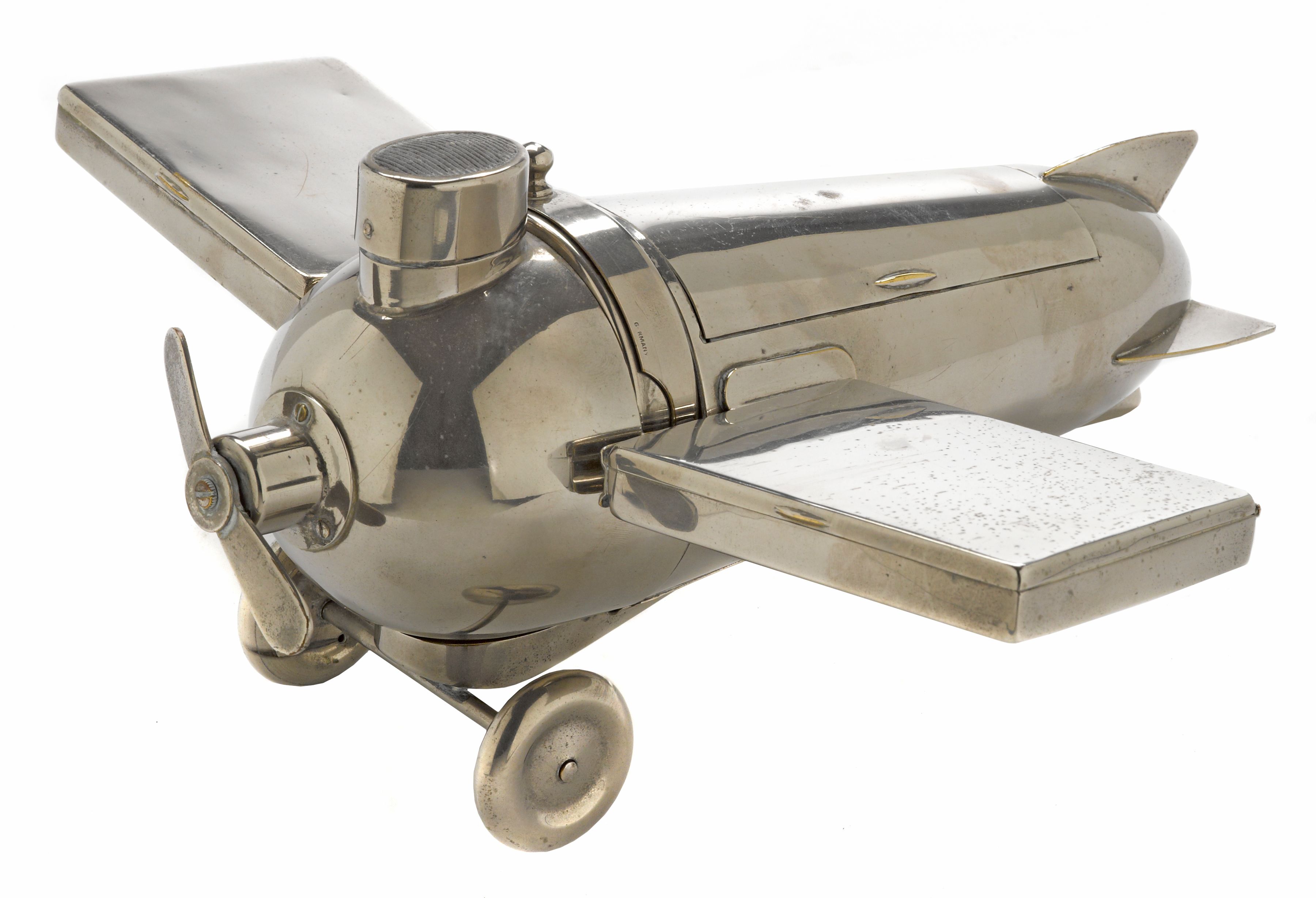 Bonhams Cars : A silver-plated cigar and cigarette caddie air plane c ...