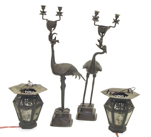 Bonhams : A pair of metal standing crane candle holders