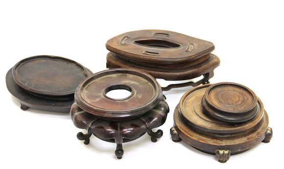 Bonhams : A large group of Chinese decorative wood bases and stands