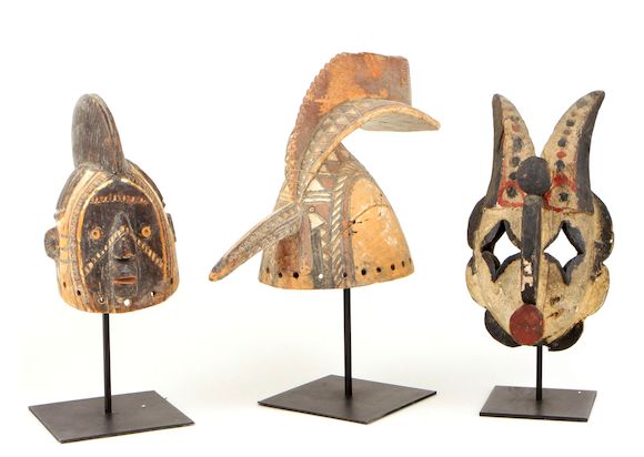 Bonhams : Three African masks including: A Mossi Tribe helmet mask with ...