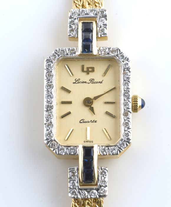 Bonhams : A diamond, sapphire and 14k gold integral bracelet wristwatch ...