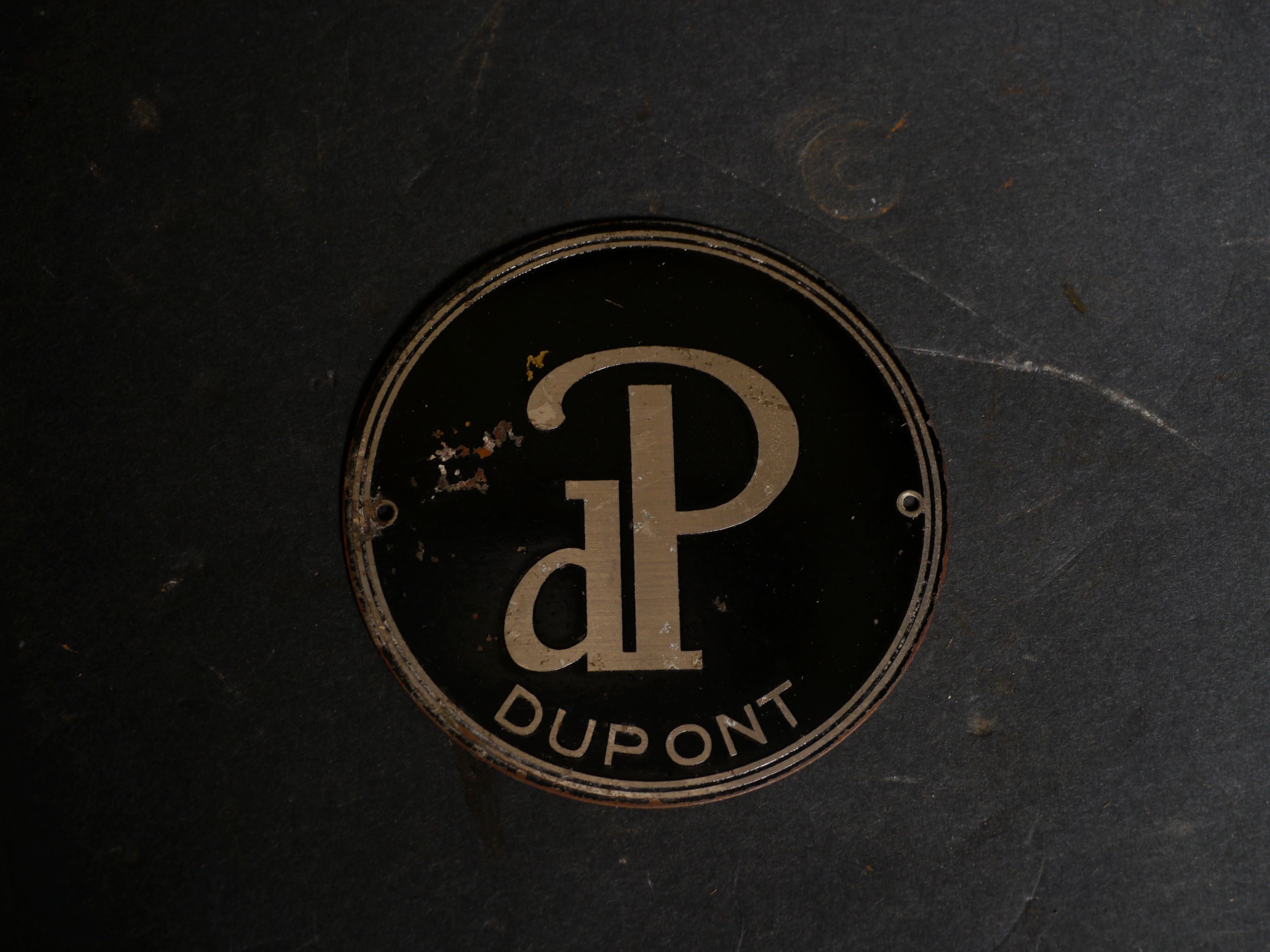 Bonhams Cars : A large duPont wheel emblem.
