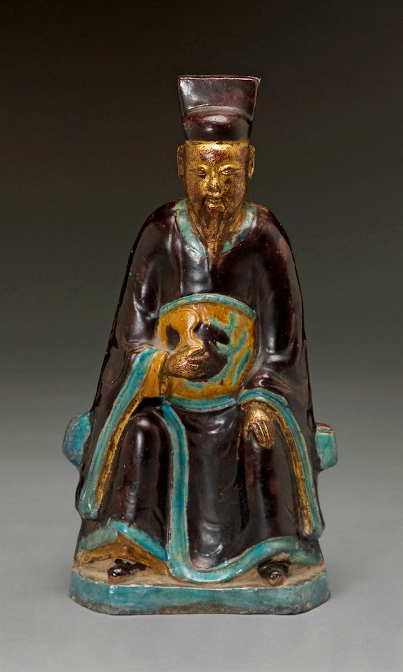 Bonhams : A three-color glazed pottery figure of a Daoist divinity Ming ...