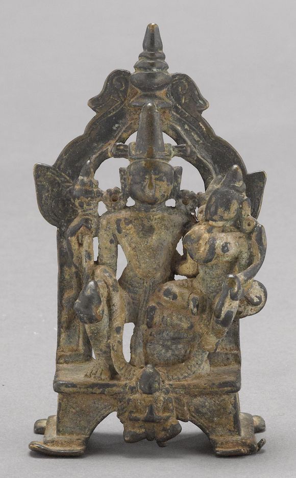 Bonhams : A Bengali copper alloy shrine depicting Vishnu and consort ...