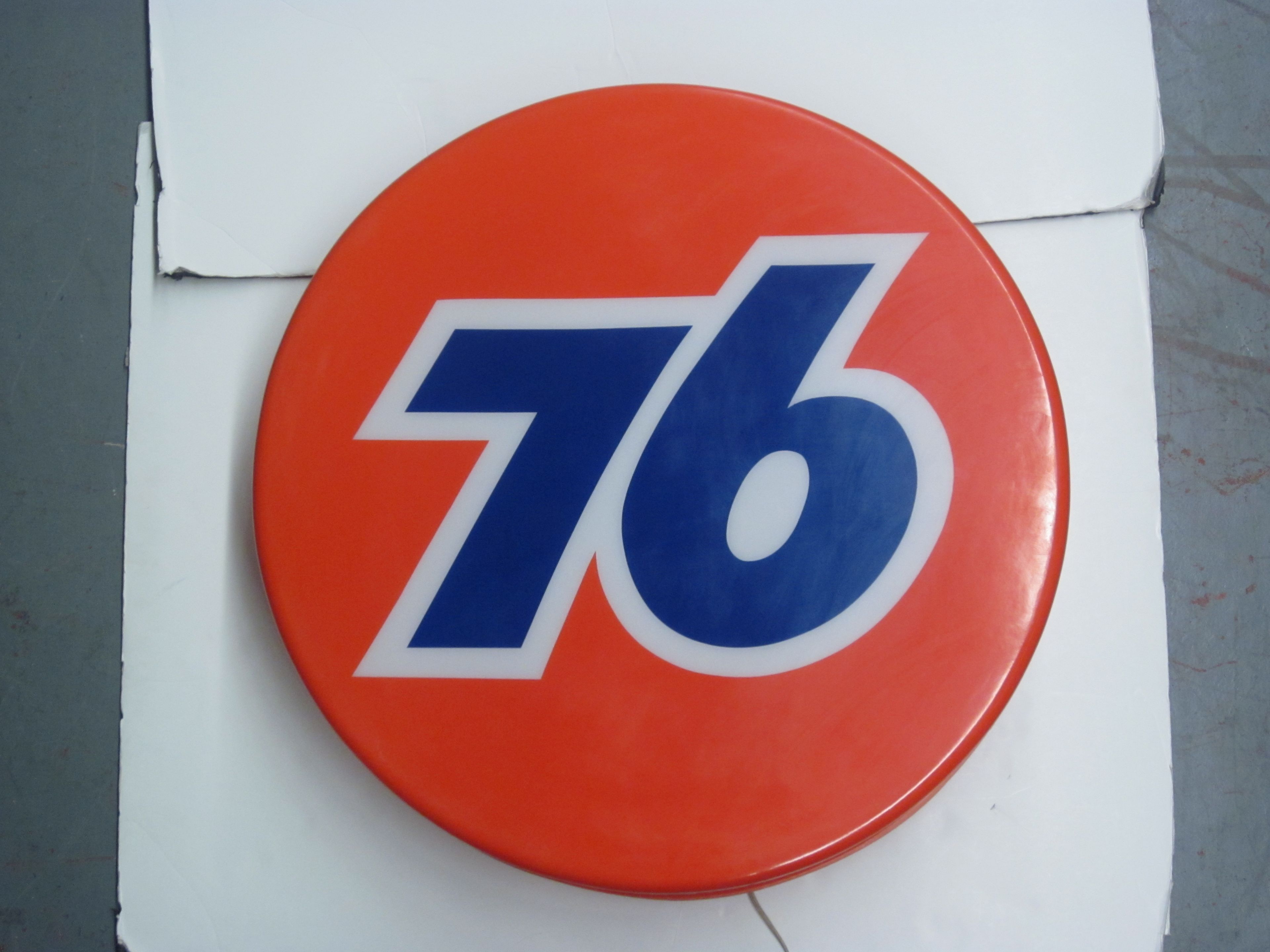 Bonhams Cars : An illuminated 76 service station sign,