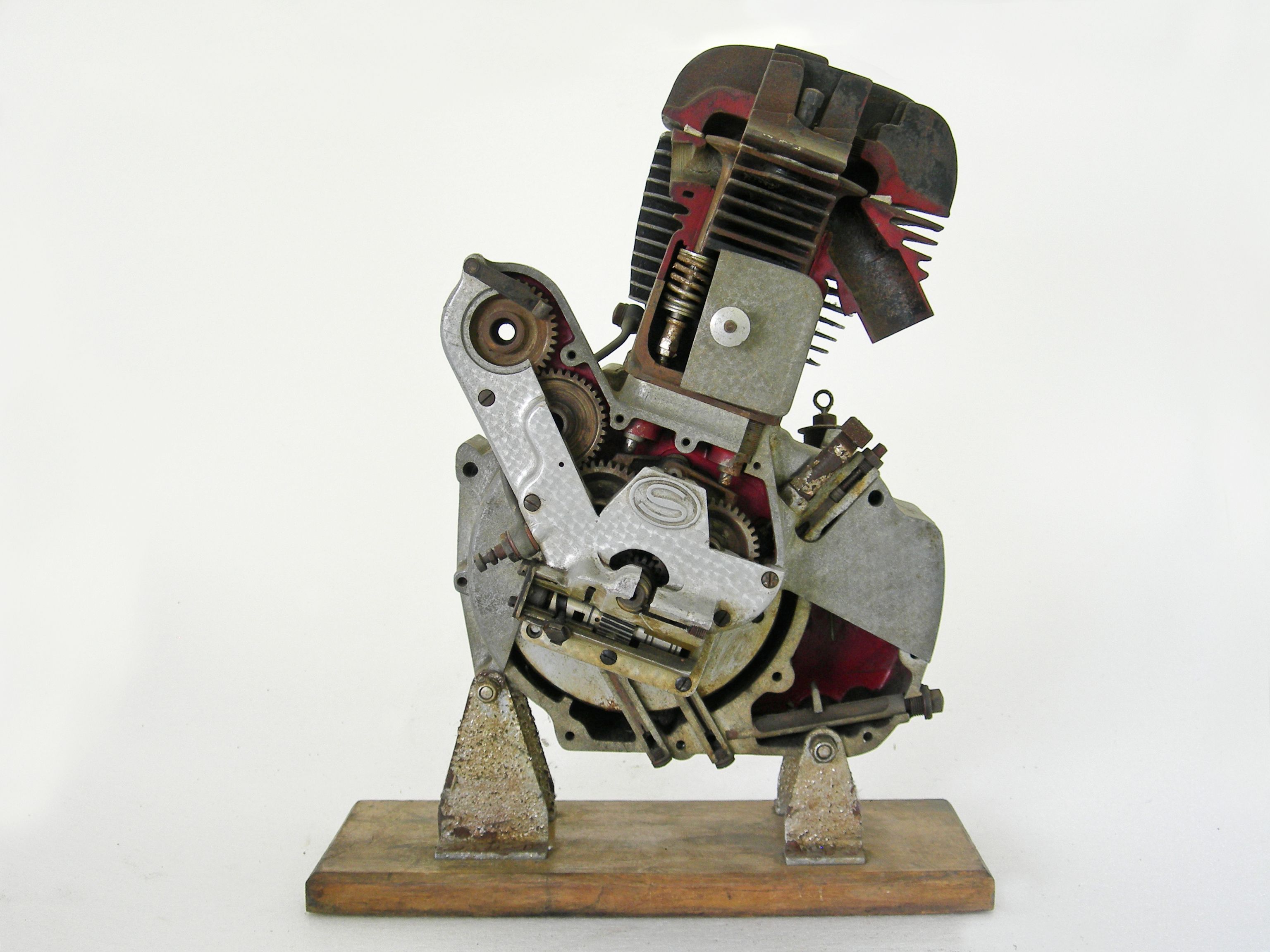 Bonhams Cars : A large single cylinder cutaway engine.