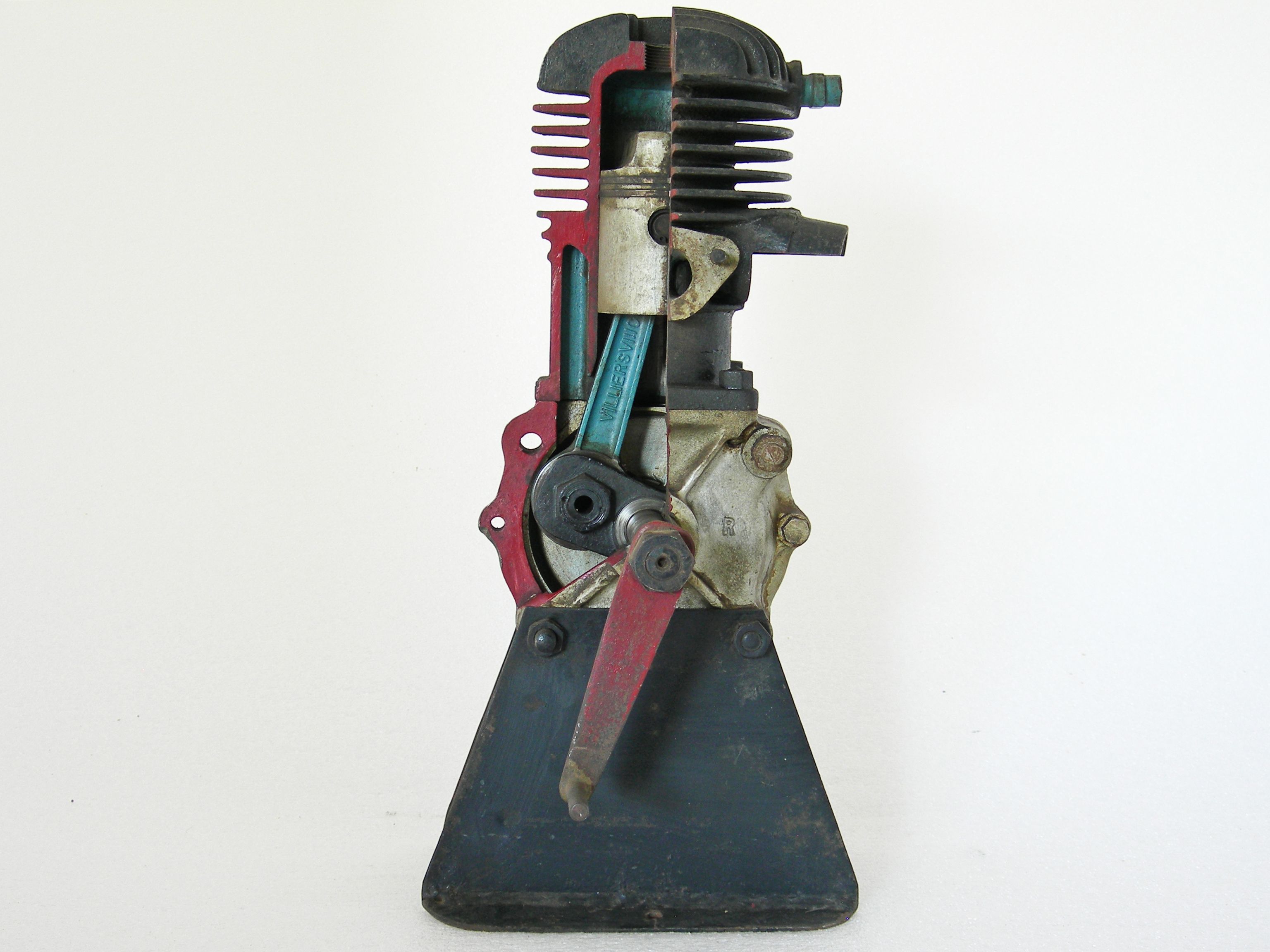 Bonhams Cars : A singe cylinder, two stroke cutaway engine.