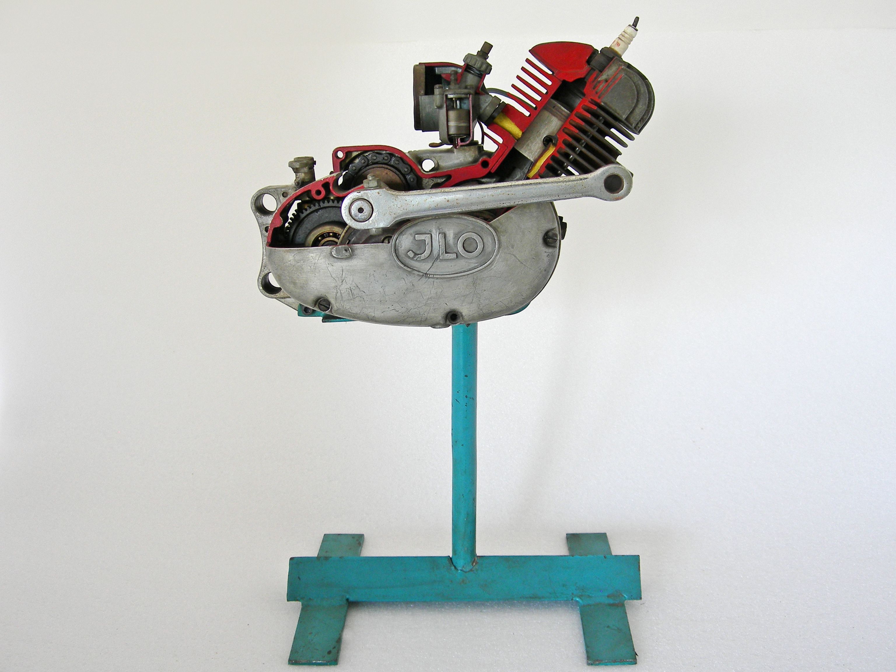 Bonhams Cars : A cutaway JLO moped engine with stand.