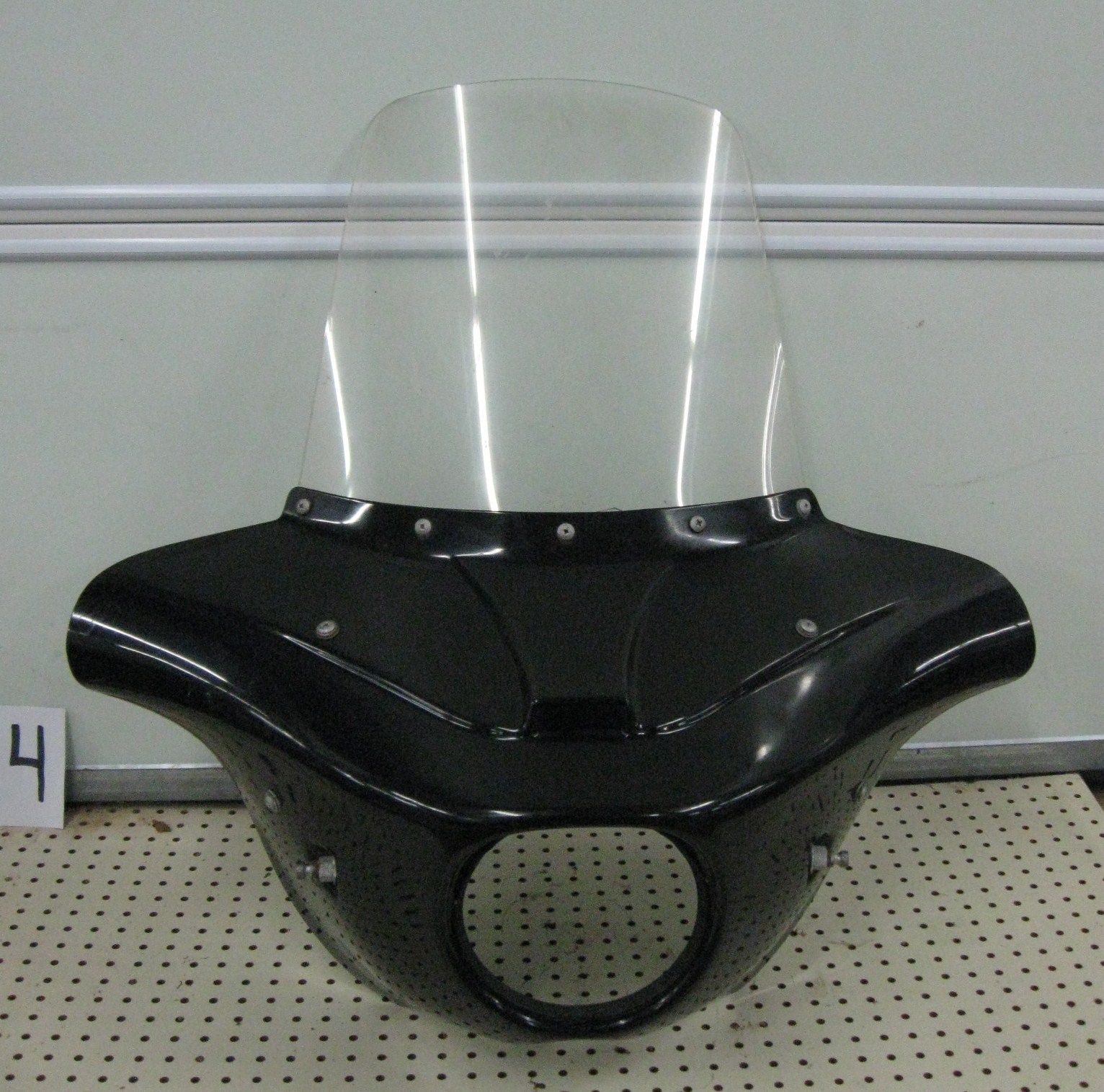 Bonhams Cars : A windshield with partial fairing,