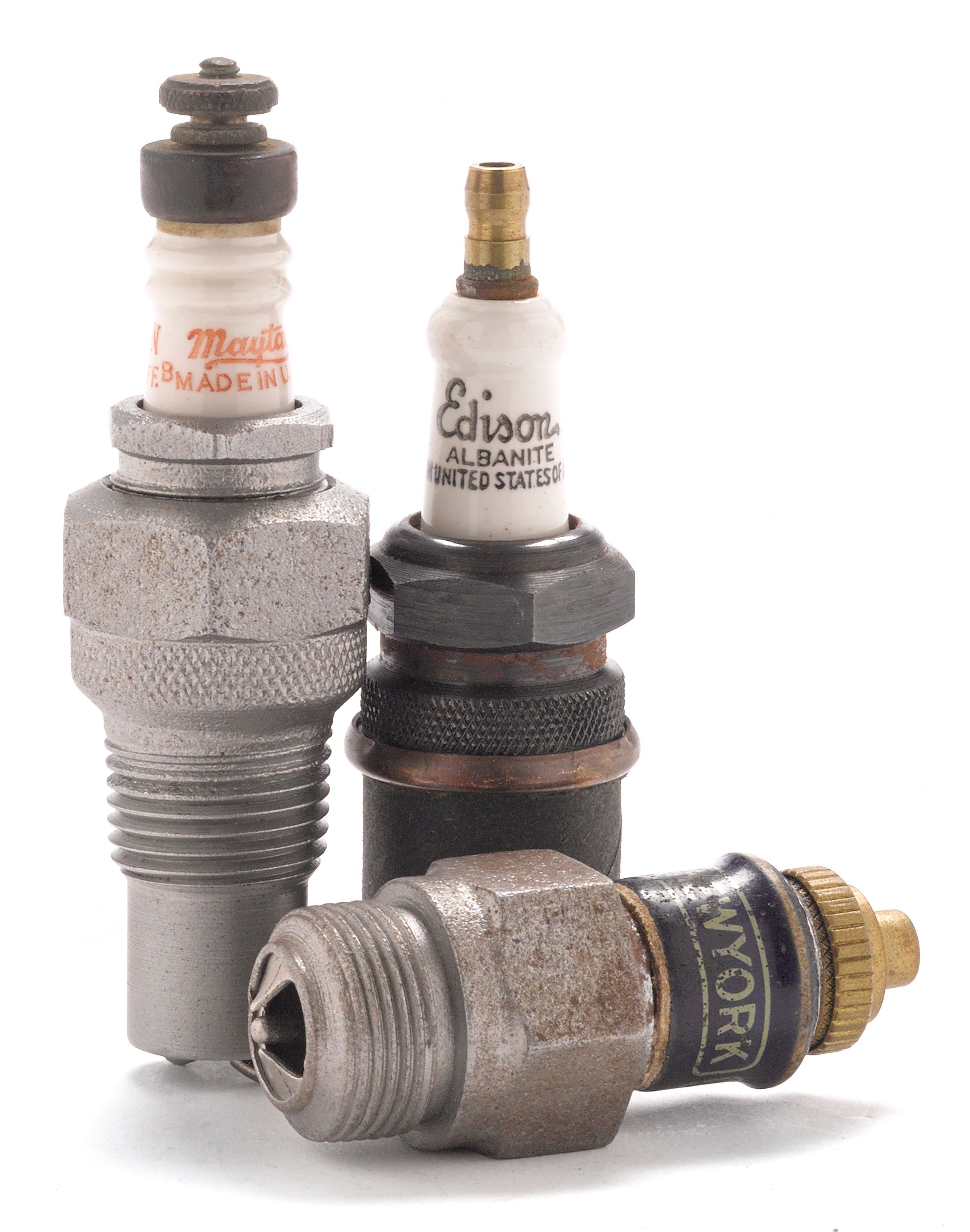Bonhams Cars : A lot of three spark plugs, circa 1920s