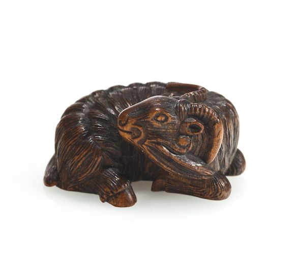 Bonhams : A wood netsuke of a recumbent goat Edo period (19th century)