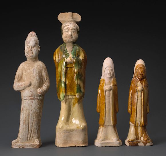 Bonhams : A group of four pottery tomb figures Tang dynasty