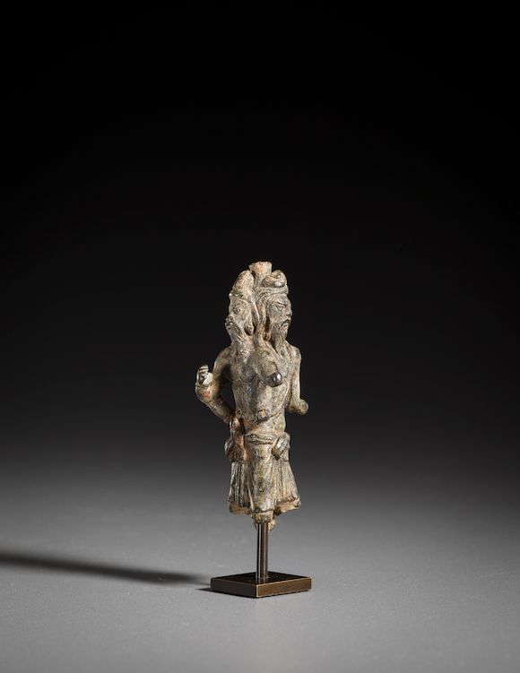 Bonhams : A copper alloy three-sided Shaivite figural group Ancient ...