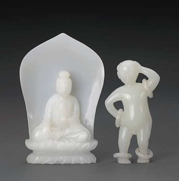 Bonhams : Two white glass statues