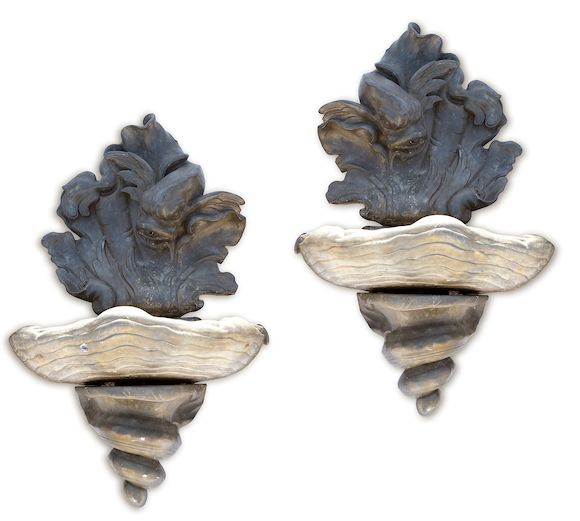 Bonhams : A pair of Baroque style 'grotto' patinated lead wall fountains