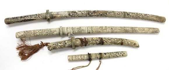 Bonhams : Four carved bone mounted swords Meiji period