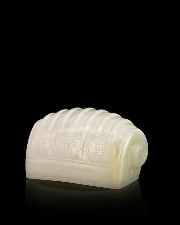 Bonhams : A white jade ornament carved in the form of a guanmao 18th ...