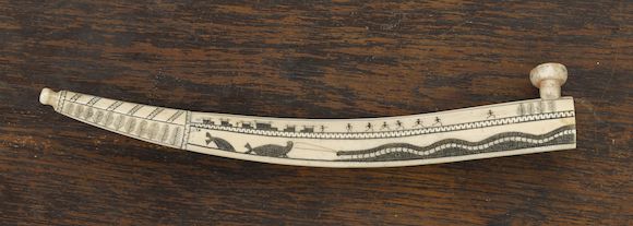 Bonhams : An Eskimo ivory scrimshaw pipe