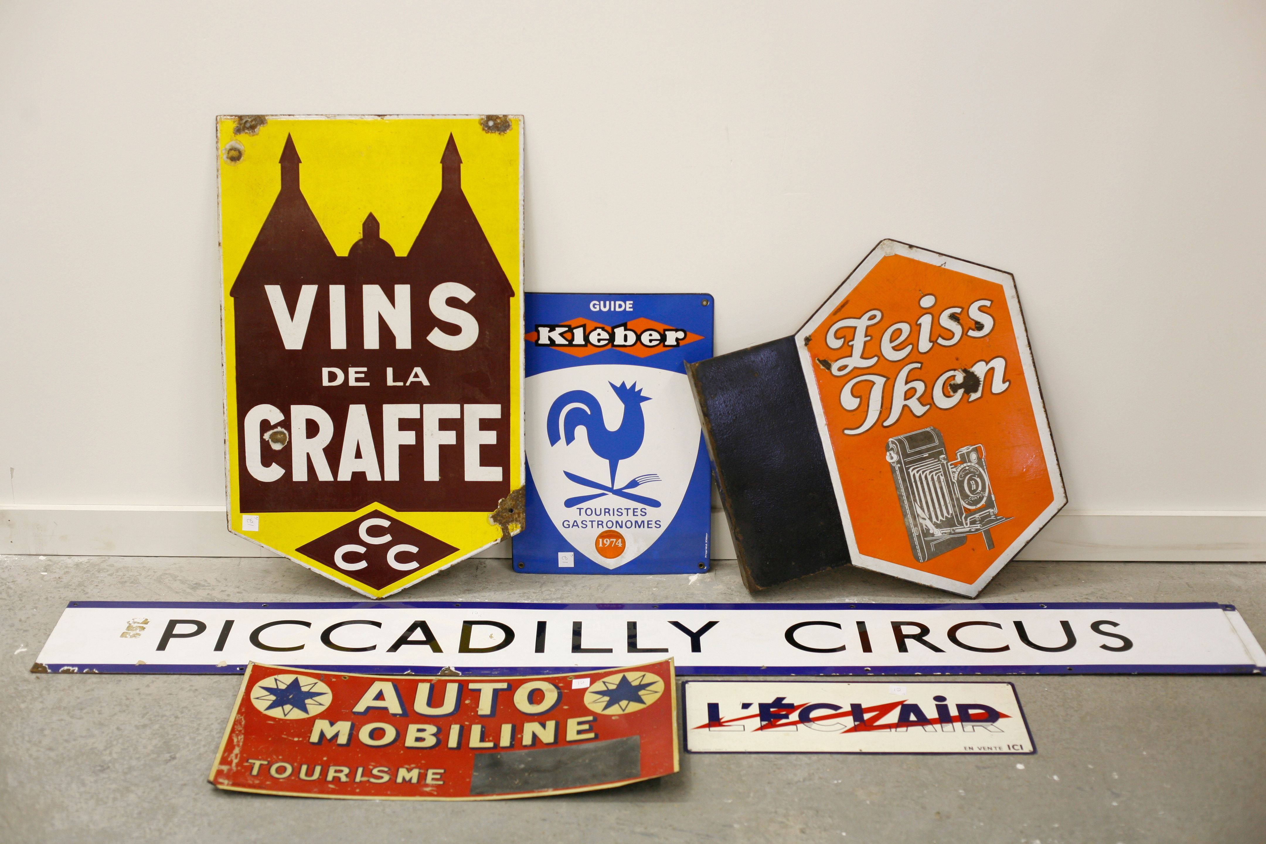 Bonhams Cars : An assembled grouping of advertising signs,