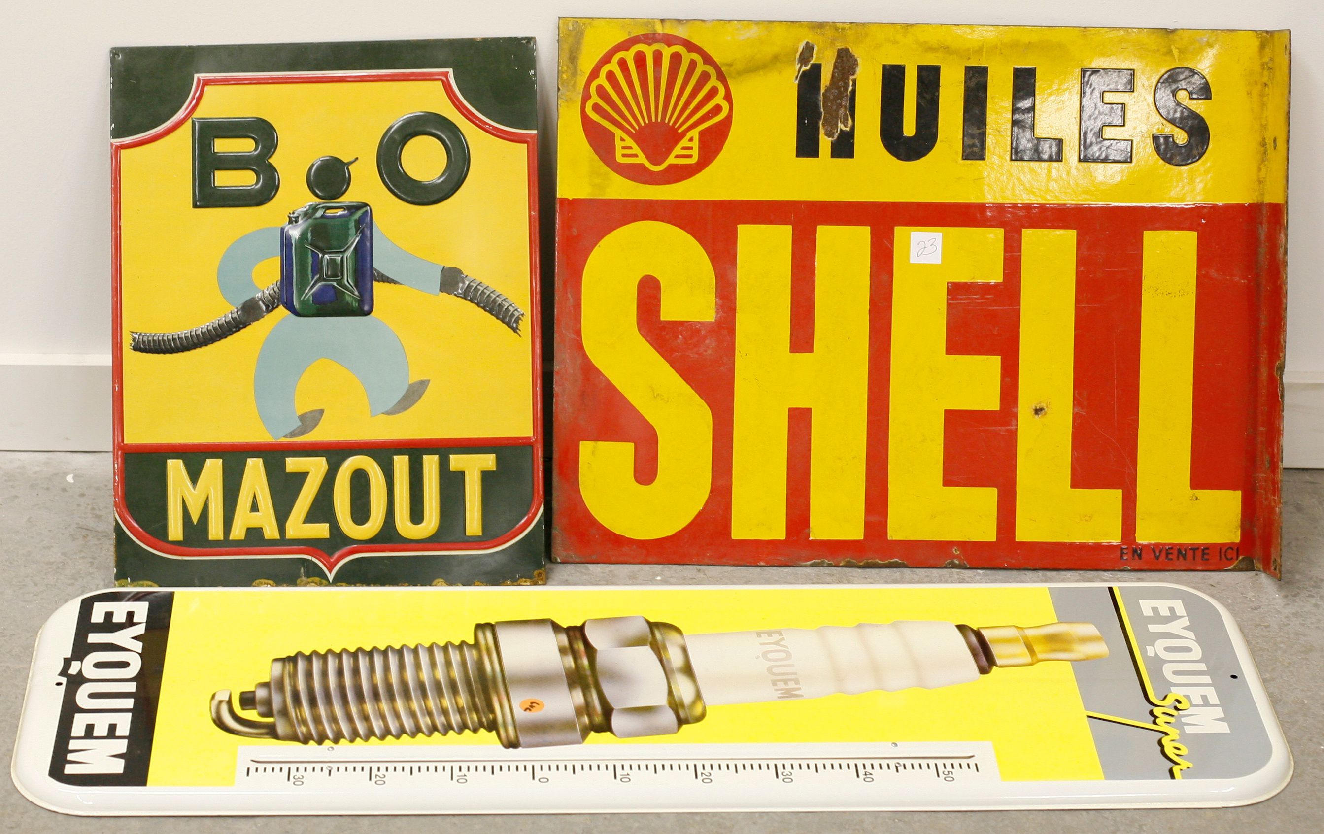 Bonhams Cars : A double-sided porcelain shell flange sign,