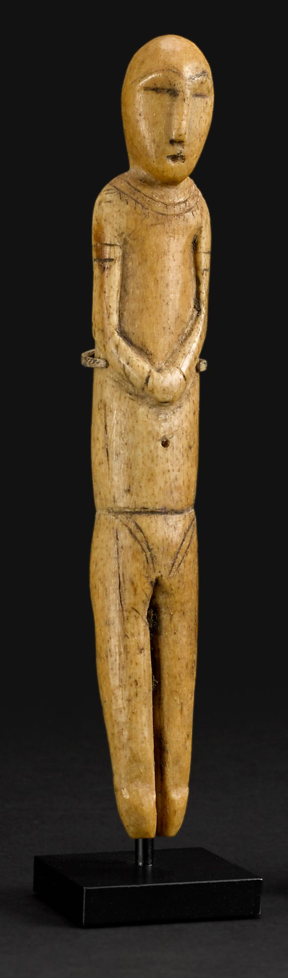 Bonhams : An Eskimo bone figure