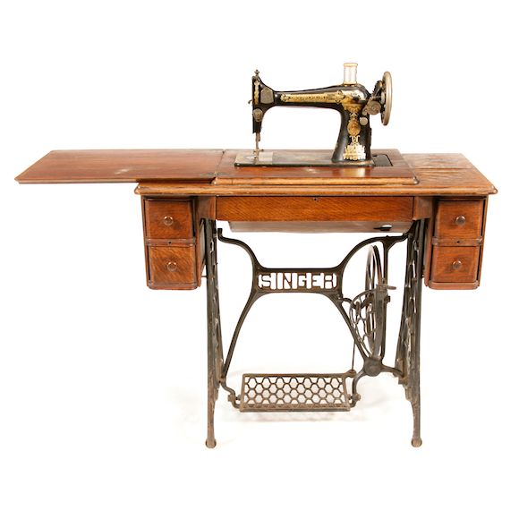 Bonhams : An early iron and oak Singer sewing table