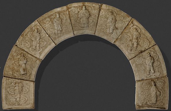 Bonhams : A nine-sectioned carved stone arch 17th/18th century