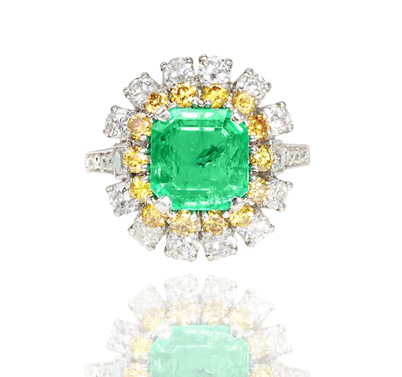 Bonhams : An emerald, colored diamond and diamond ring