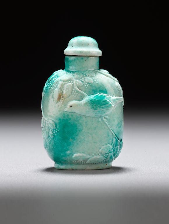 Bonhams : A glazed porcelain snuff bottle imitating jadeite Qianlong mark, 19th century