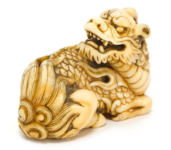 Bonhams : An ivory netsuke of a recumbent kirin By Okatomo, Kyoto, Edo ...