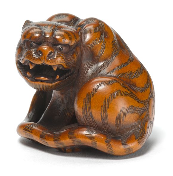 Bonhams : A wood netsuke of a tiger By Masanao, Ise, Edo period (19th ...
