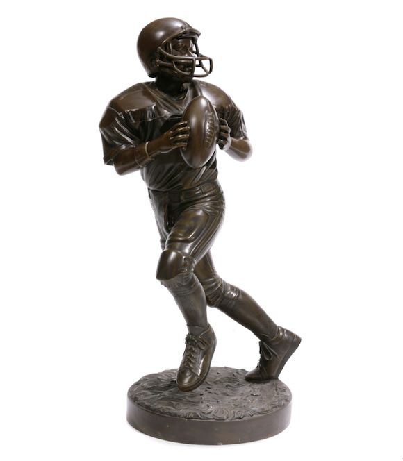 Bonhams : A patinated bronze figure of a football player