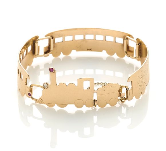 Bonhams : A diamond, ruby, and 14k gold train motif bracelet