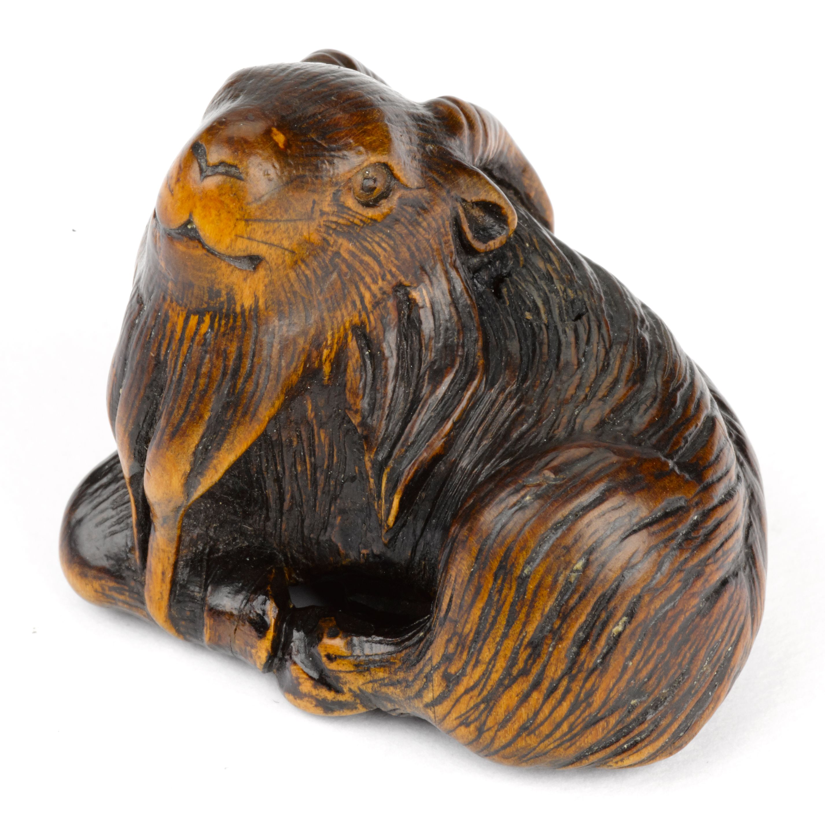 Bonhams : A wood netsuke of a recumbent goat By Masamichi, late Edo ...