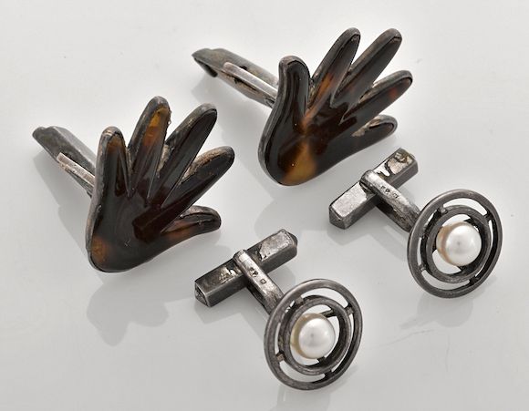 Bonhams : A pair of tortoise shell and silver 'hand' cufflinks together ...