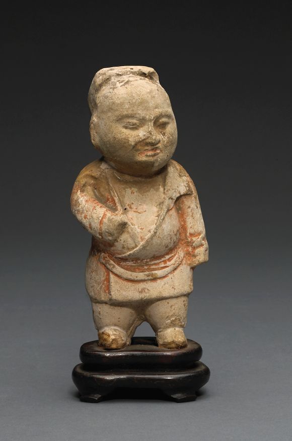 Bonhams : A painted pottery figure of a dwarf Tang