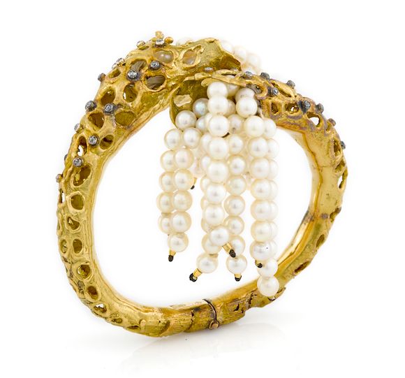 Bonhams : A cultured pearl and diamond cornucopia motif bypass bangle ...